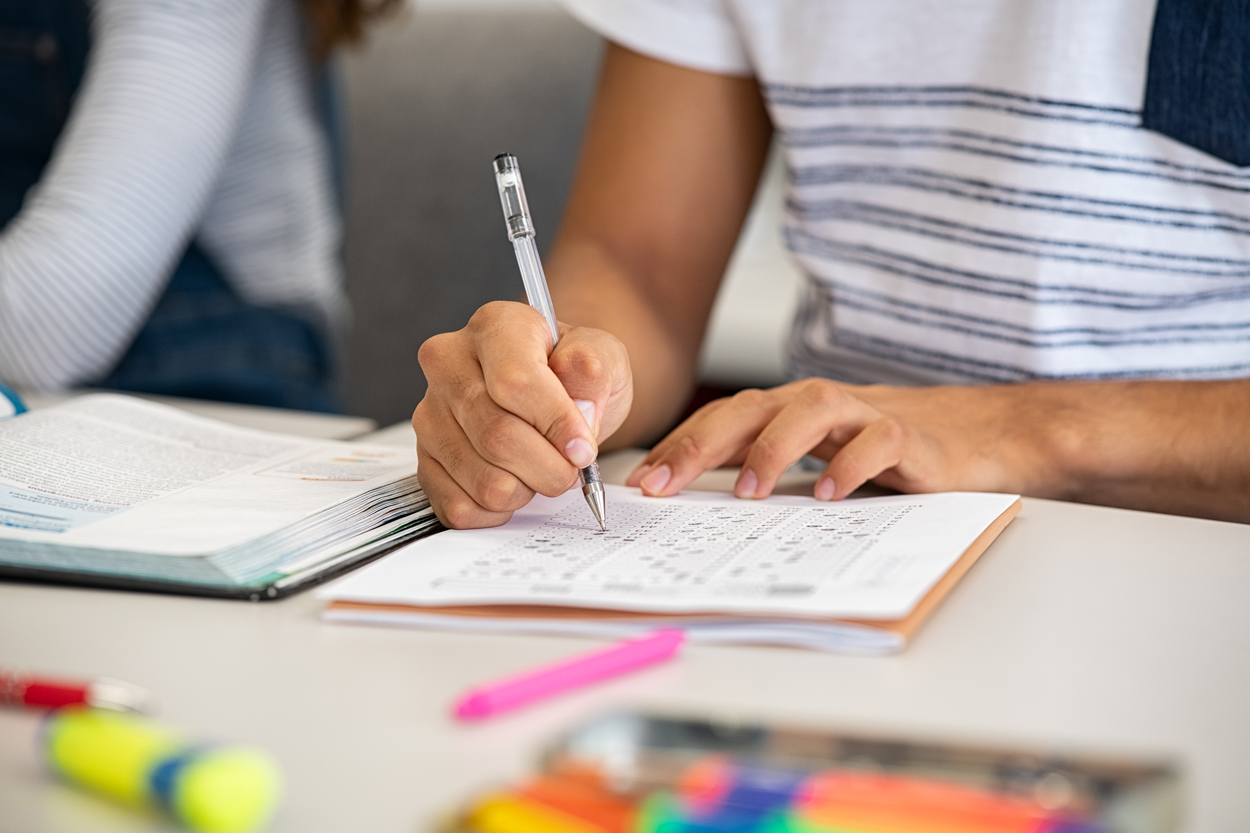 High school student filling out test answers with pen – St Lucie Public ...